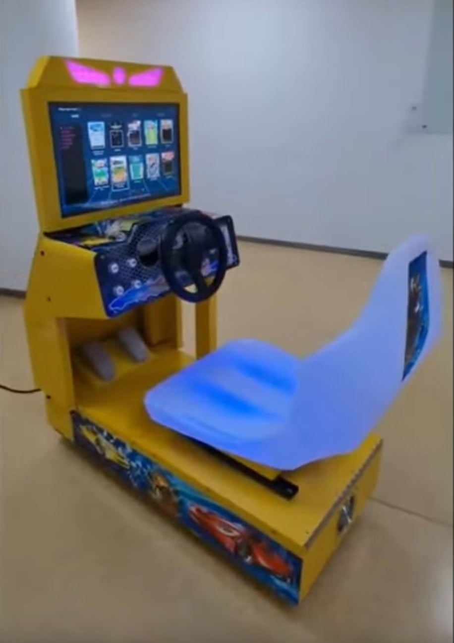 AtGames debuts new sit-down racing arcade cab | BrutalGamer